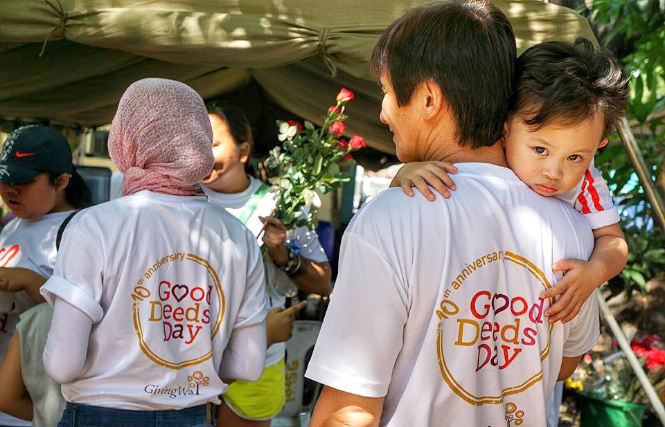 Volunteers Spreading Kindness In A Fair - Good Deeds Day